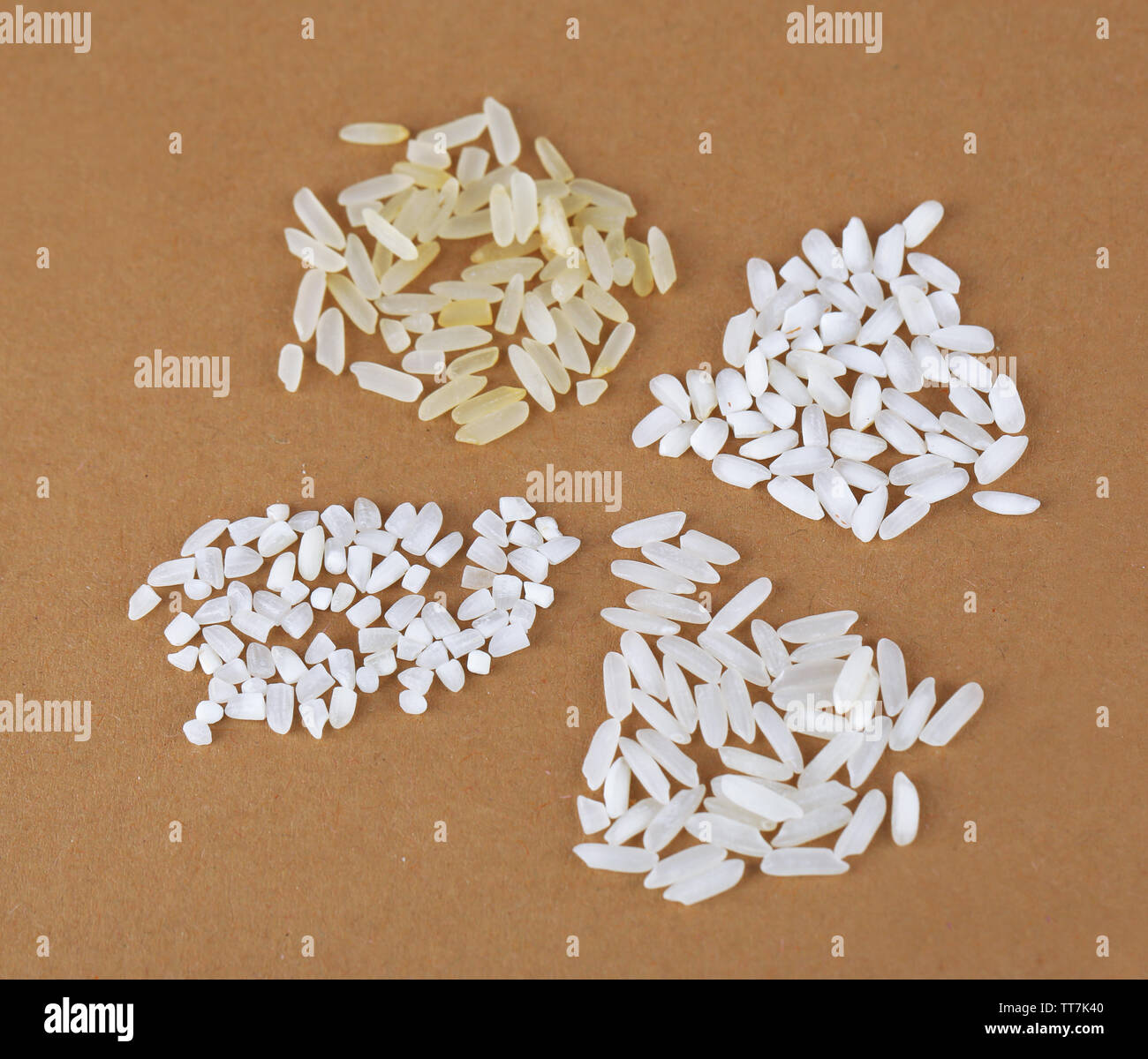 different types of rice on brown background Stock Photo - Alamy