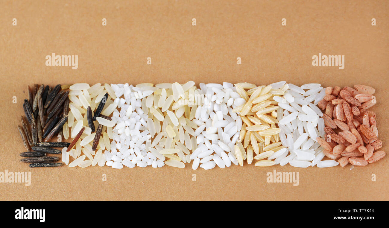 different types of rice on brown background Stock Photo - Alamy