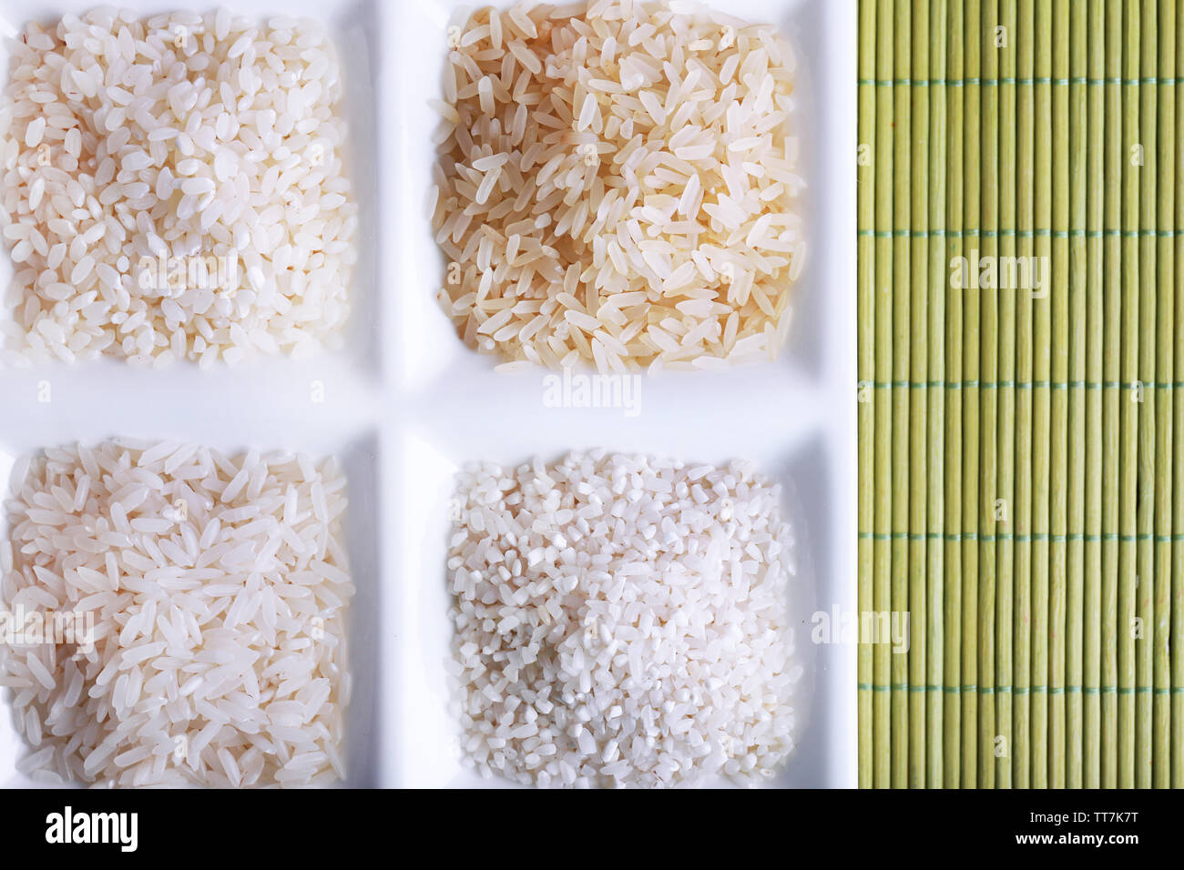 Different types of rice on plate on bamboo background Stock Photo - Alamy