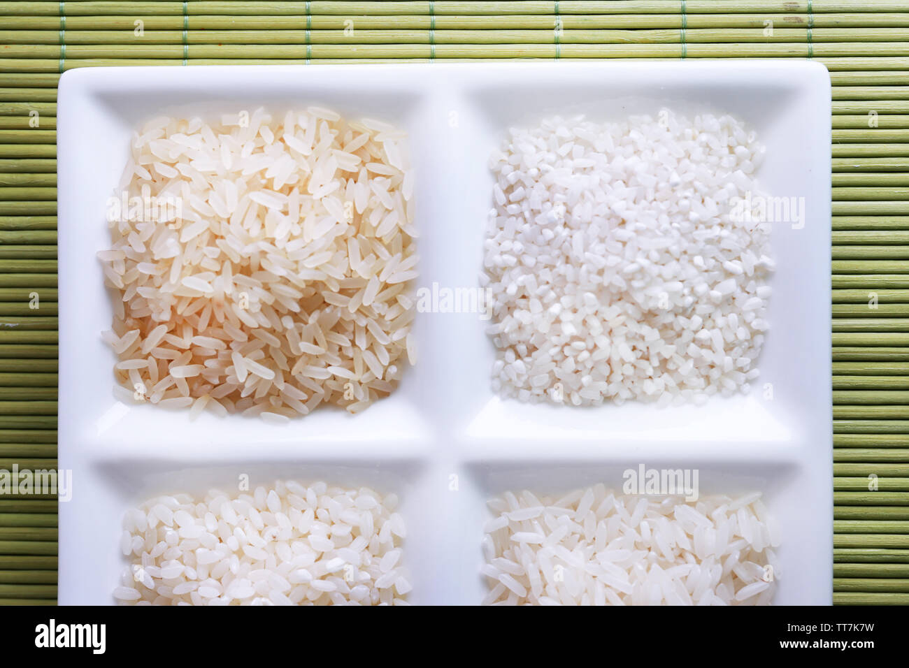 Different types of rice on plate on bamboo background Stock Photo - Alamy