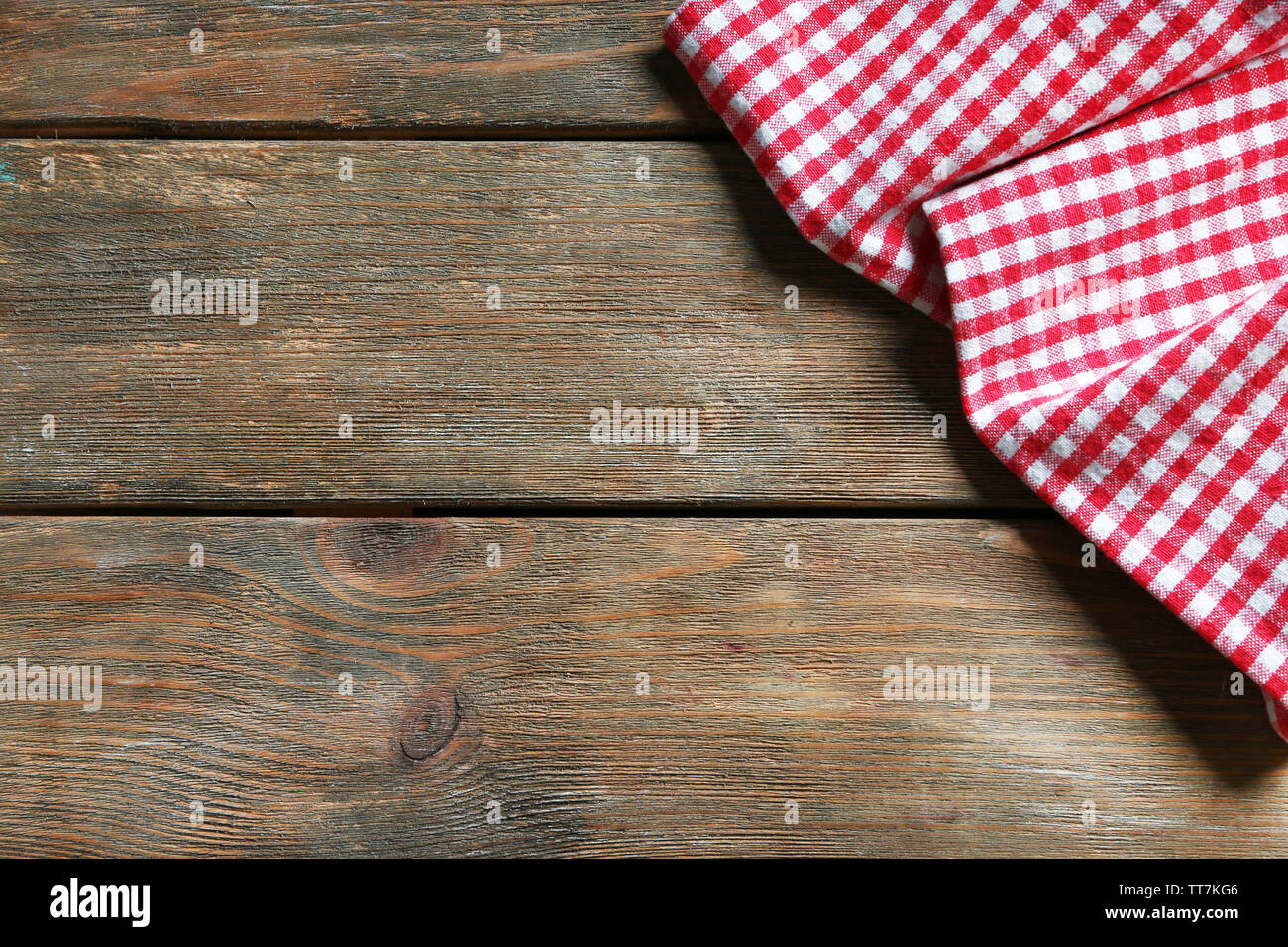 Napkin on wooden table Stock Photo - Alamy