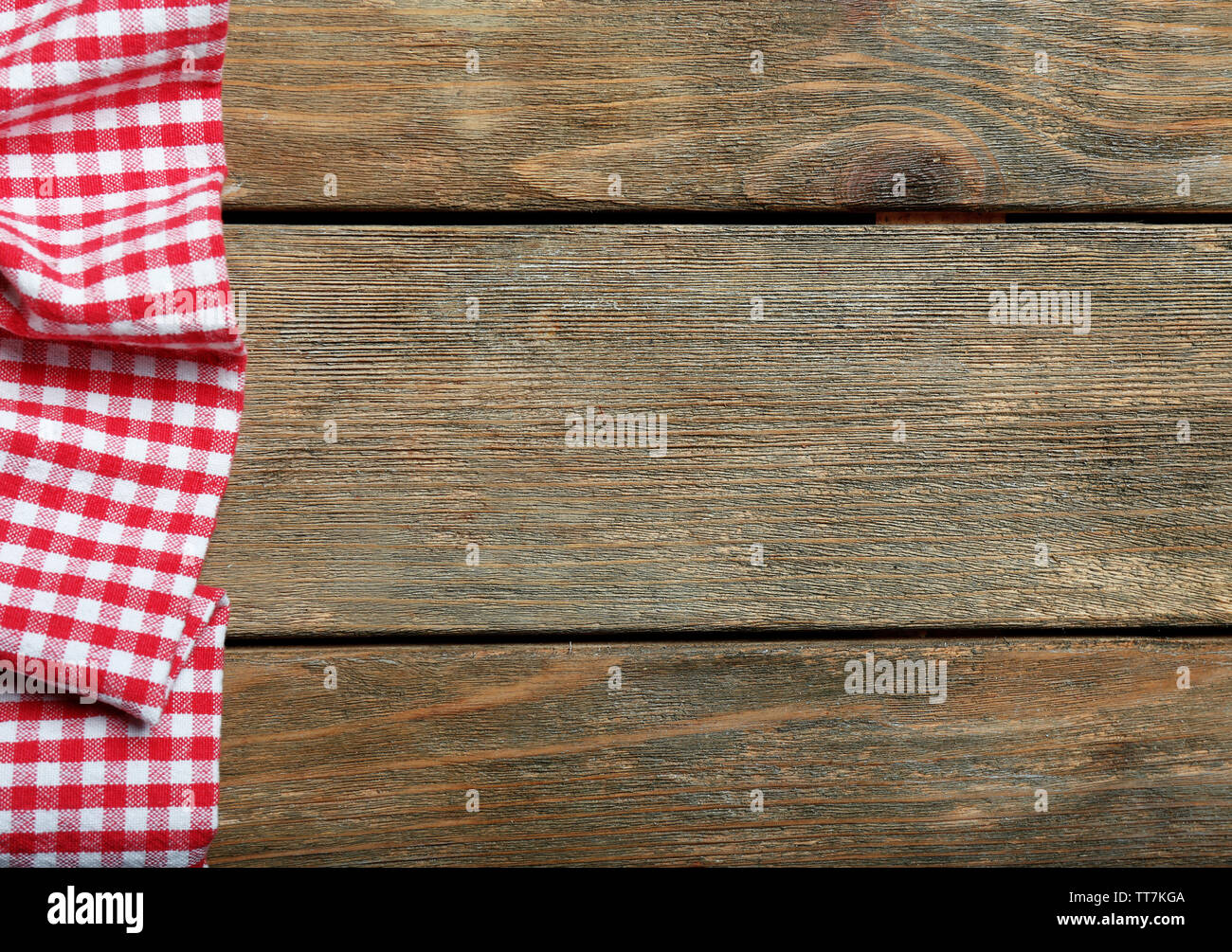 Napkin on wooden table Stock Photo - Alamy