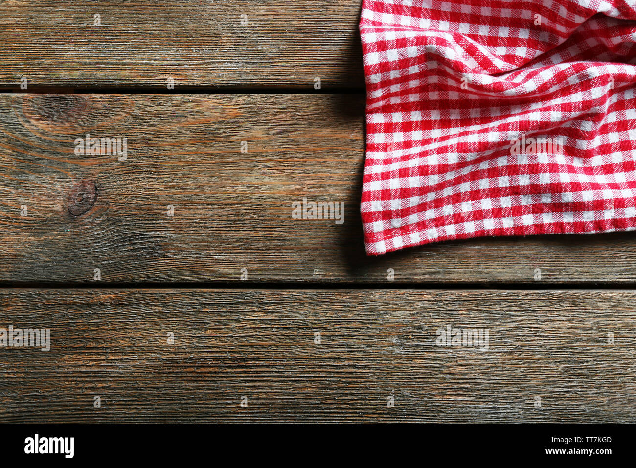 Napkin on wooden table Stock Photo - Alamy
