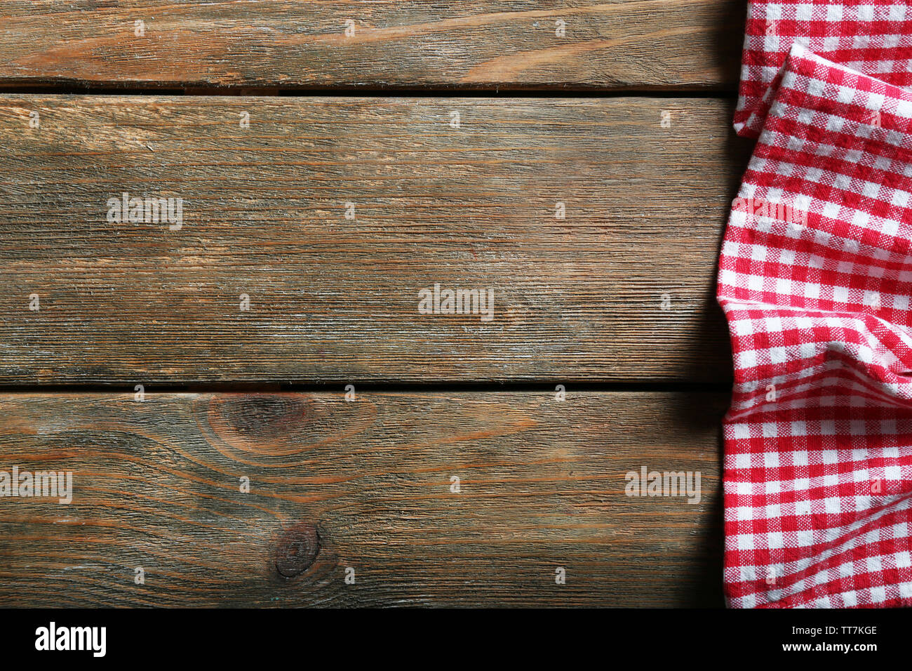 Napkin on wooden table Stock Photo - Alamy