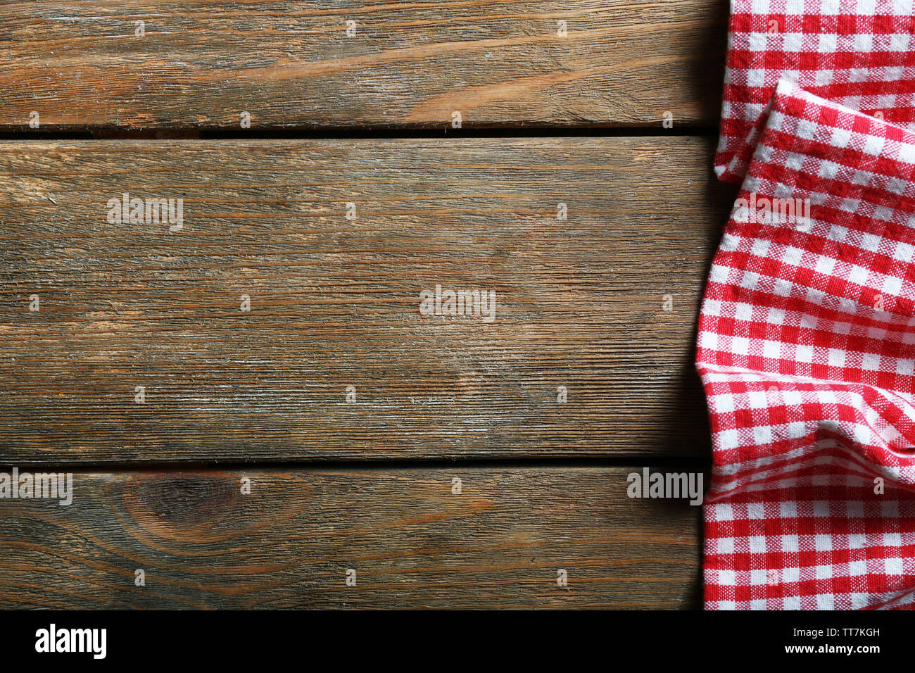 Napkin on wooden table Stock Photo - Alamy
