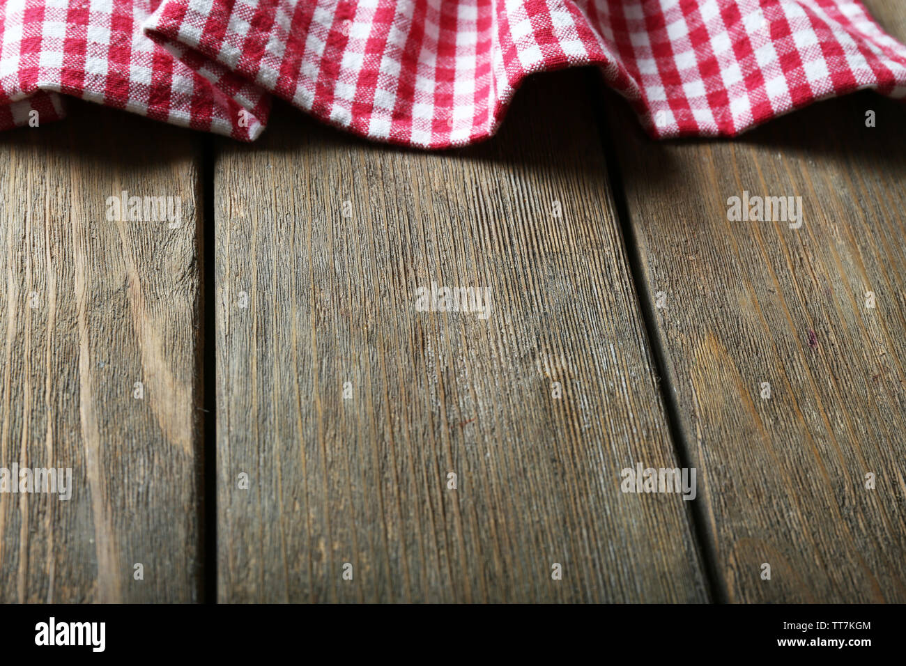Napkin on wooden table Stock Photo - Alamy