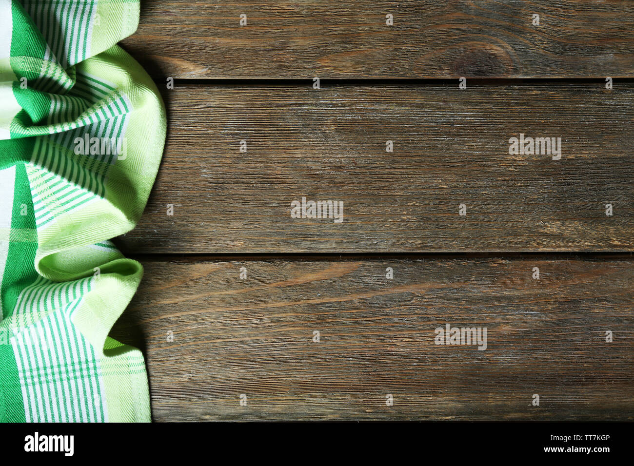 Napkin on wooden table Stock Photo - Alamy
