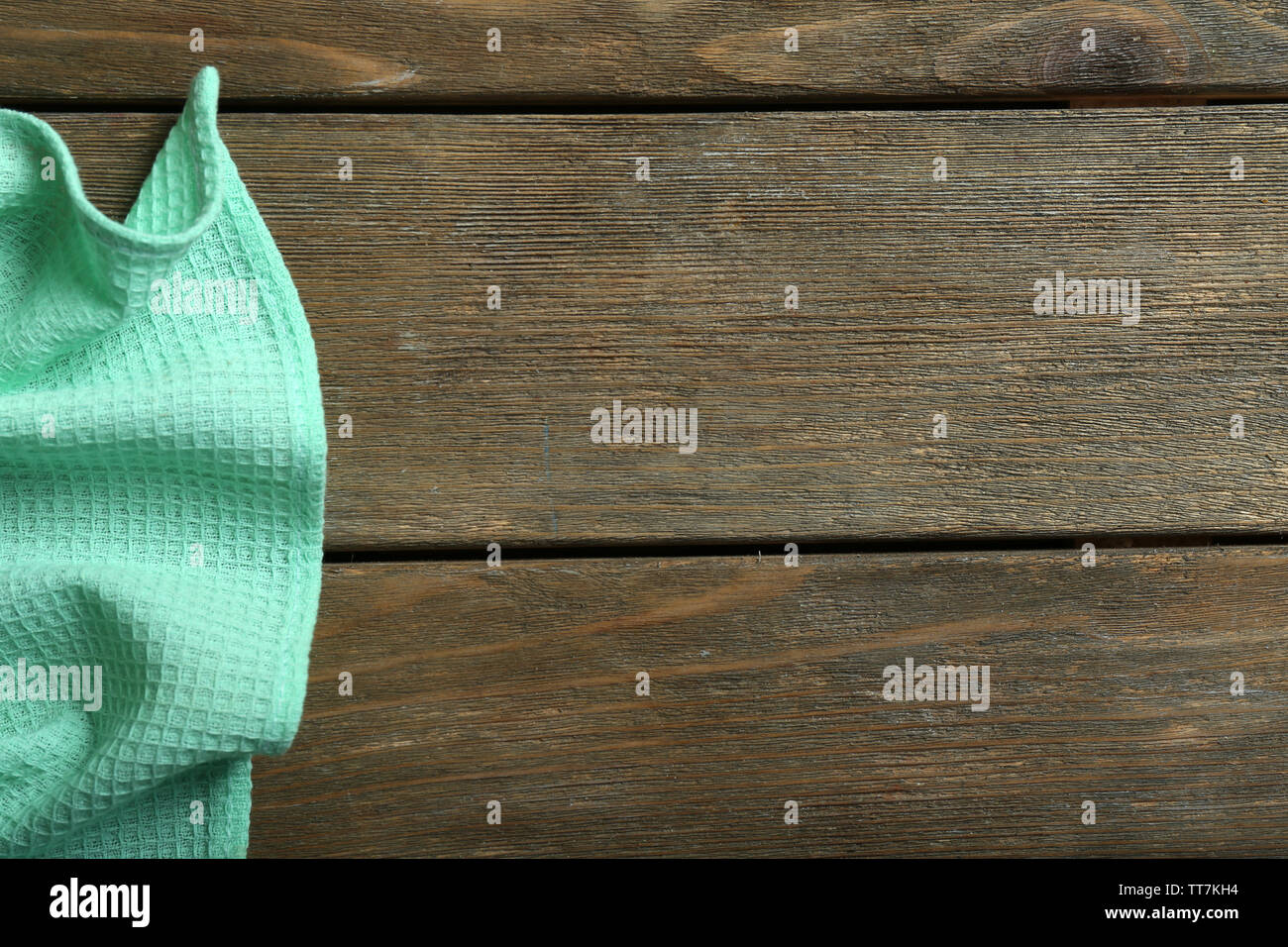 Napkin on wooden table Stock Photo - Alamy