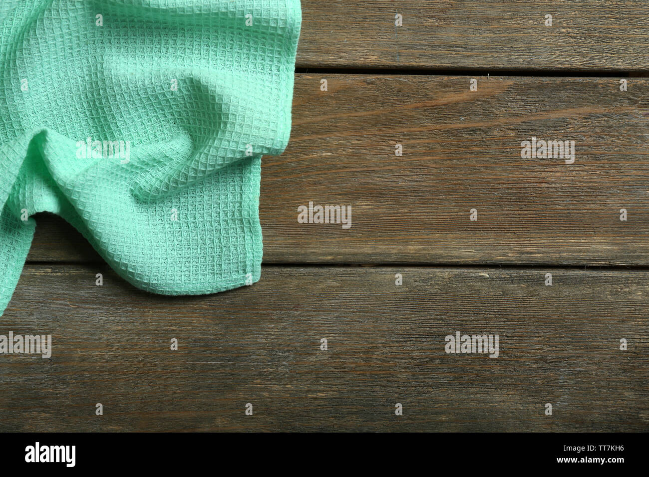 Napkin on wooden table Stock Photo - Alamy