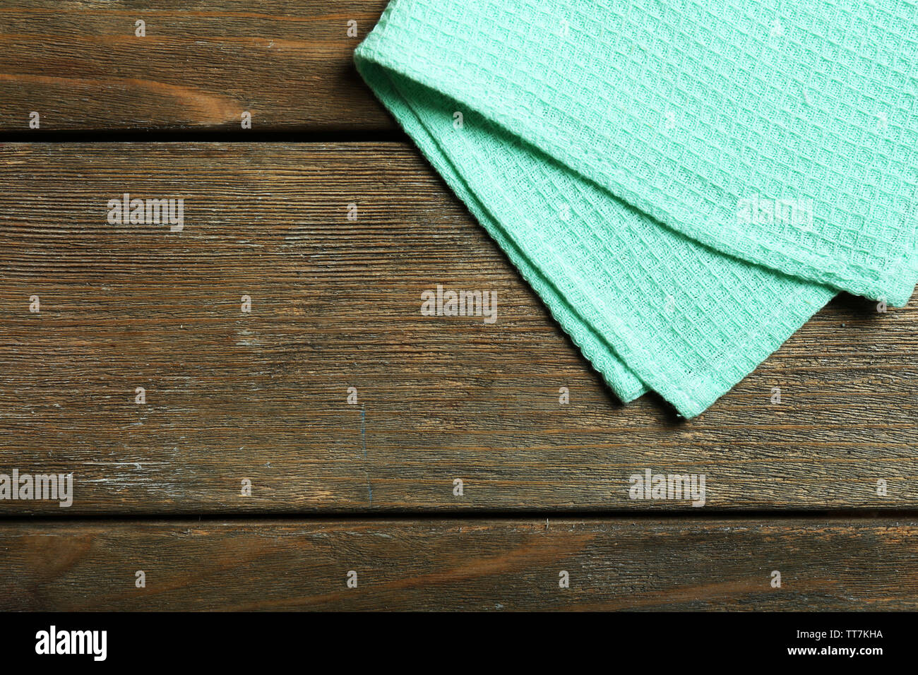 Napkin on wooden table Stock Photo - Alamy