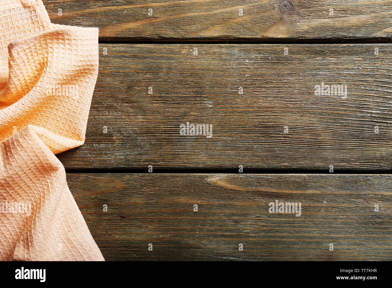 Napkin on wooden table Stock Photo - Alamy