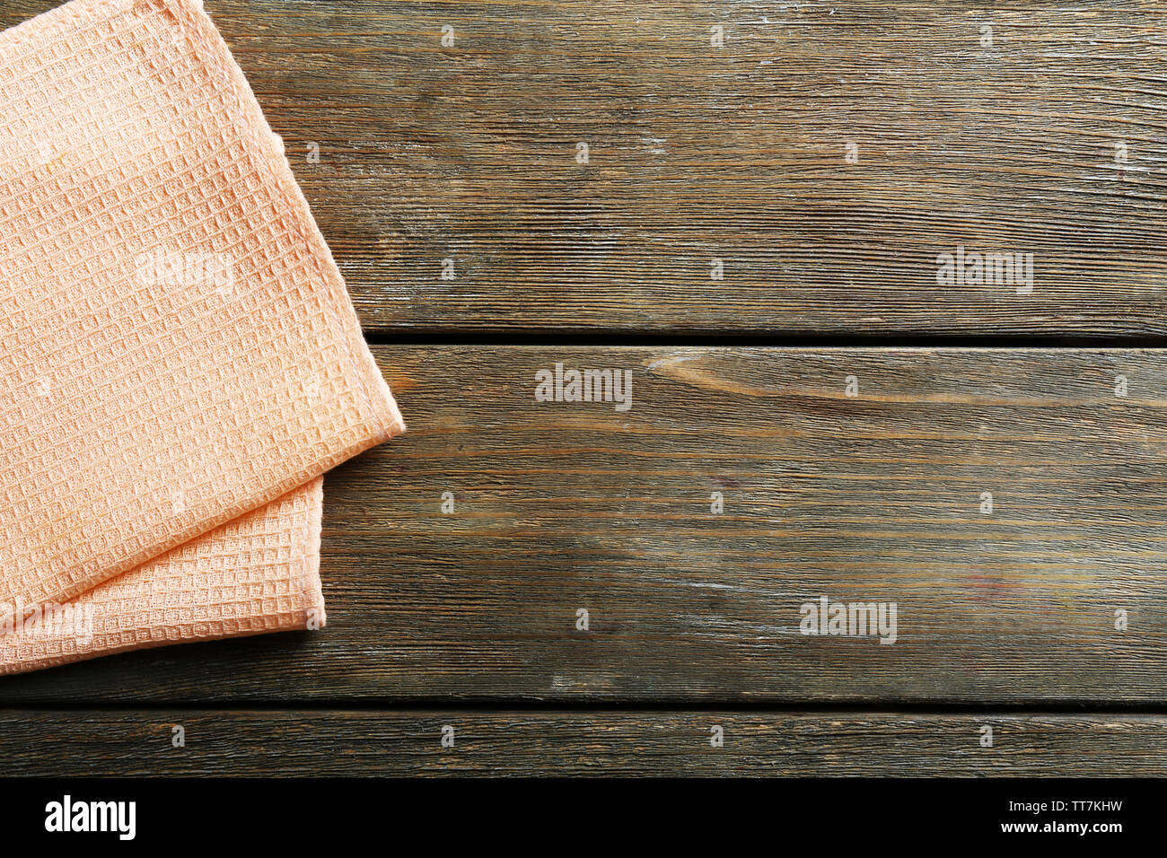 Napkin on wooden table Stock Photo - Alamy