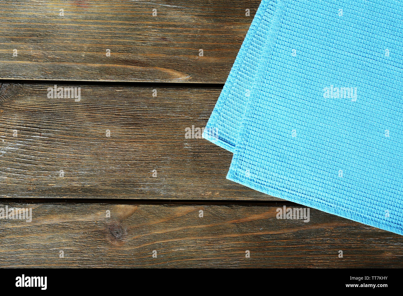 Napkin on wooden table Stock Photo - Alamy