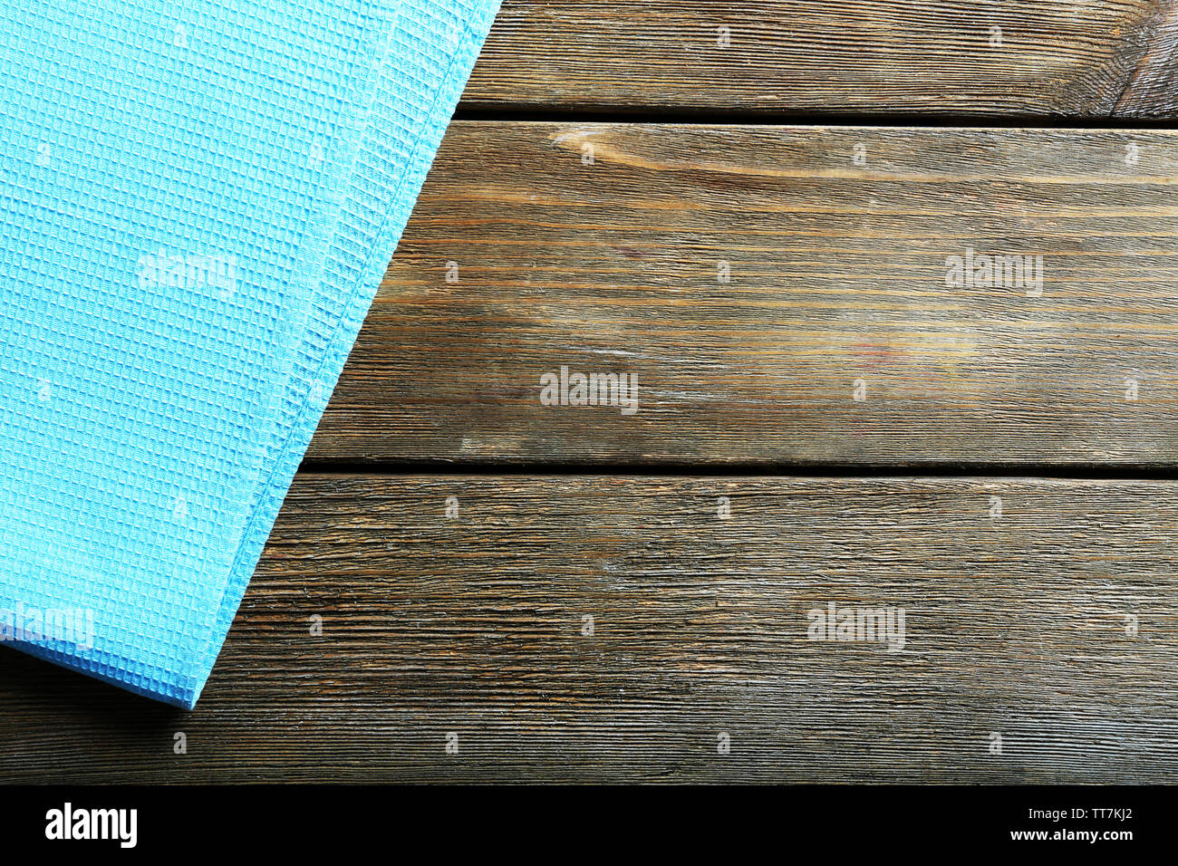 Napkin on wooden table Stock Photo - Alamy