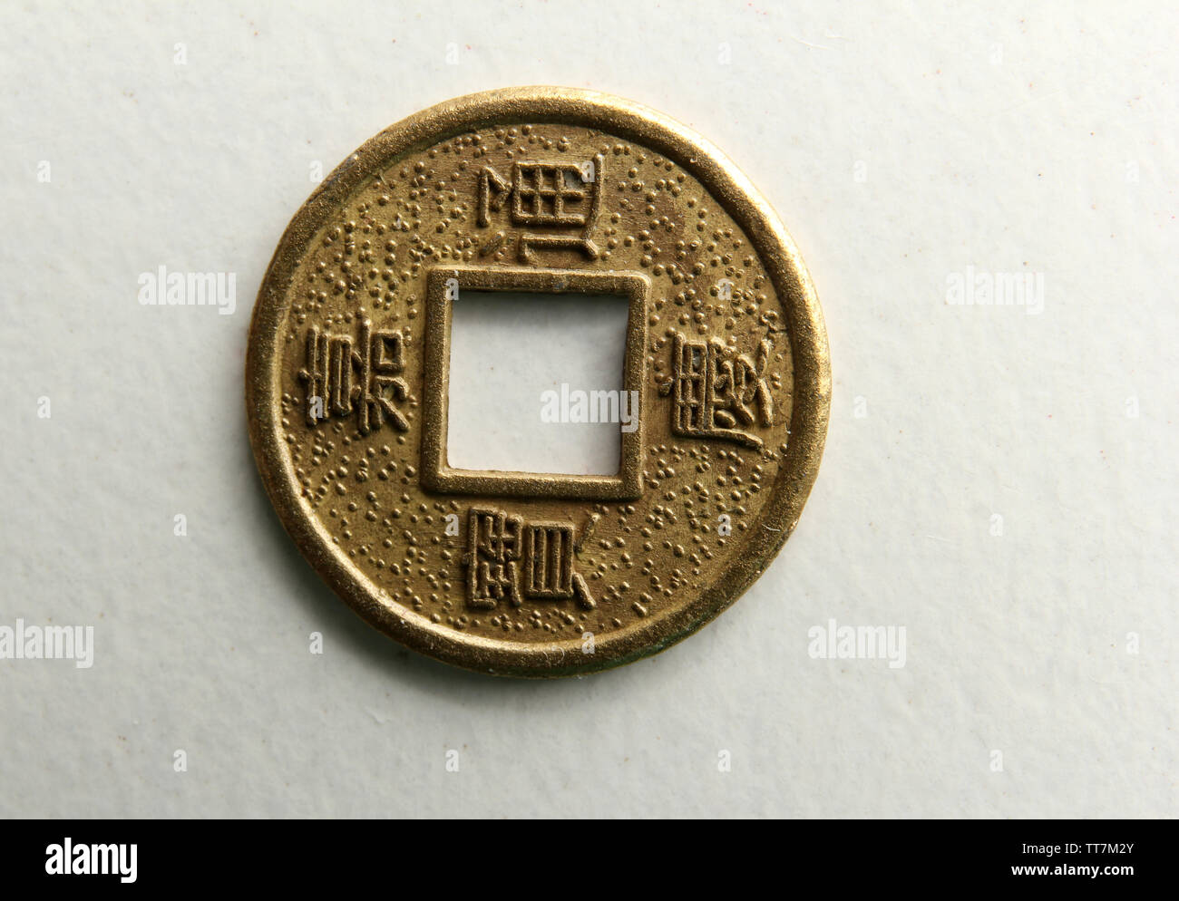 Feng shui coin isolated on white Stock Photo - Alamy