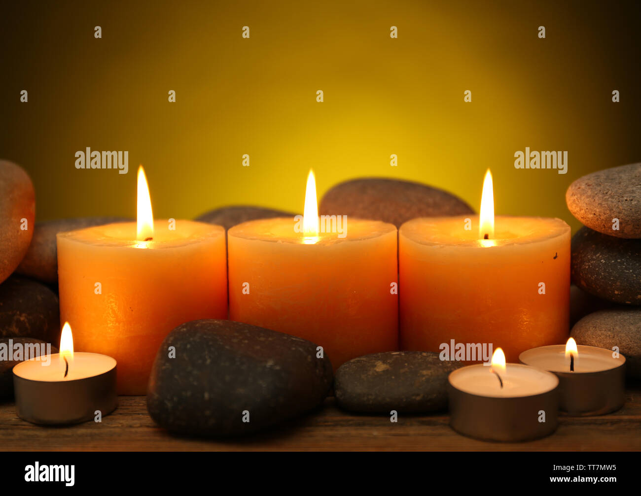 Burning candles on dark background Stock Photo - Alamy