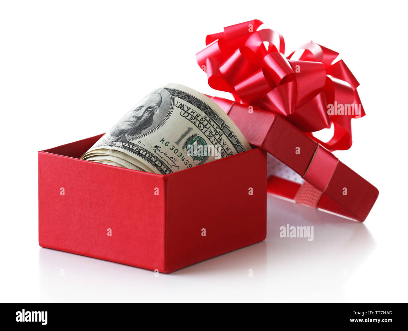 Bundle of dollars in present box with bow isolated on white Stock Photo ...