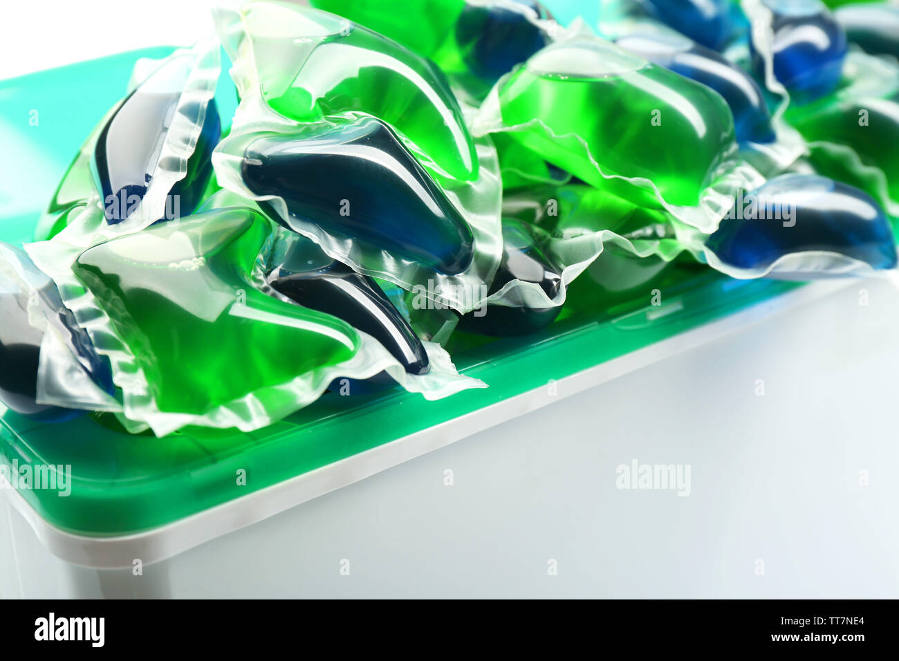 Gel capsules with laundry detergent in box close up Stock Photo - Alamy