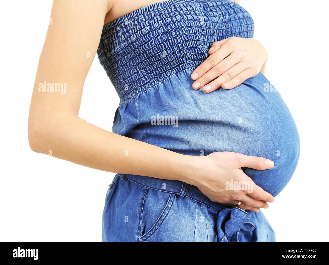 Beautiful young pregnant woman touching her belly isolated on white ...