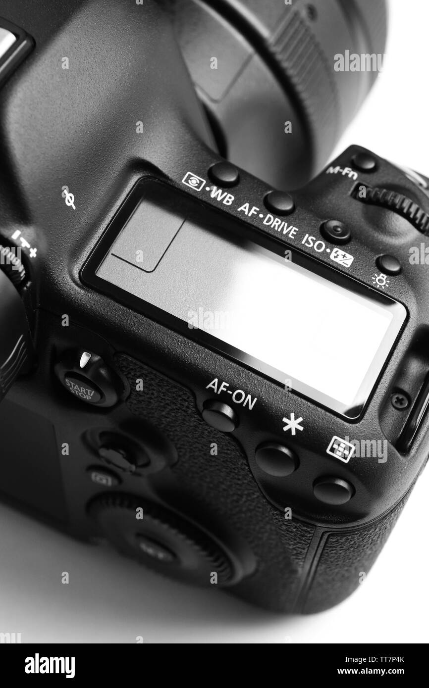 Digital camera on light background Stock Photo - Alamy