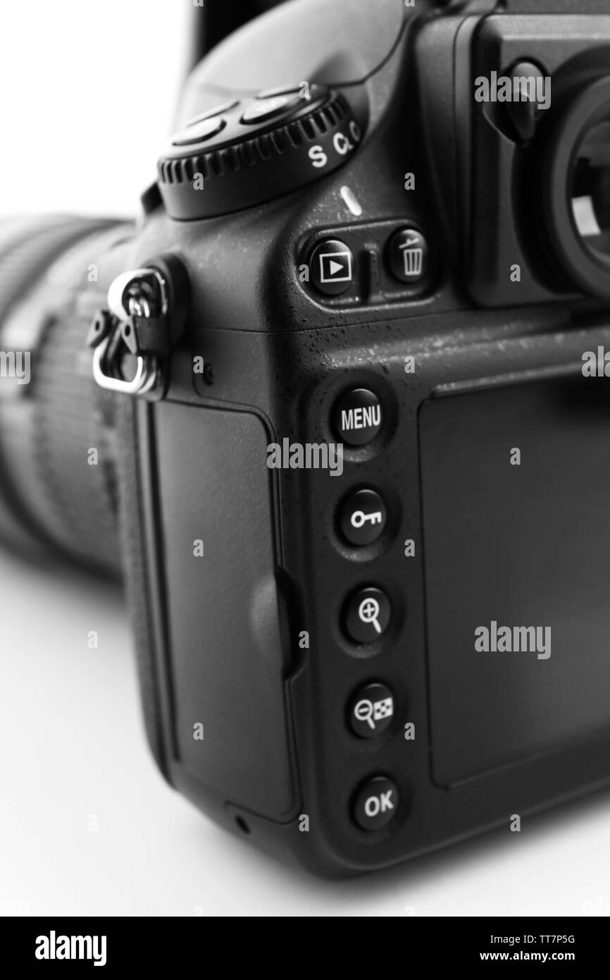 Digital camera on light background Stock Photo - Alamy