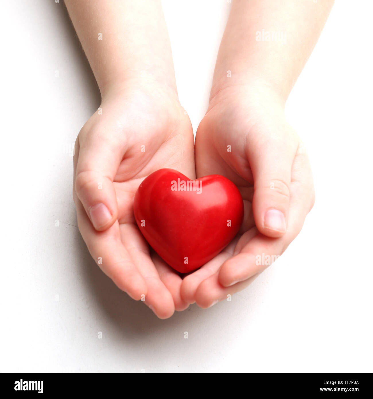 Heart in child hands isolated on white Stock Photo - Alamy