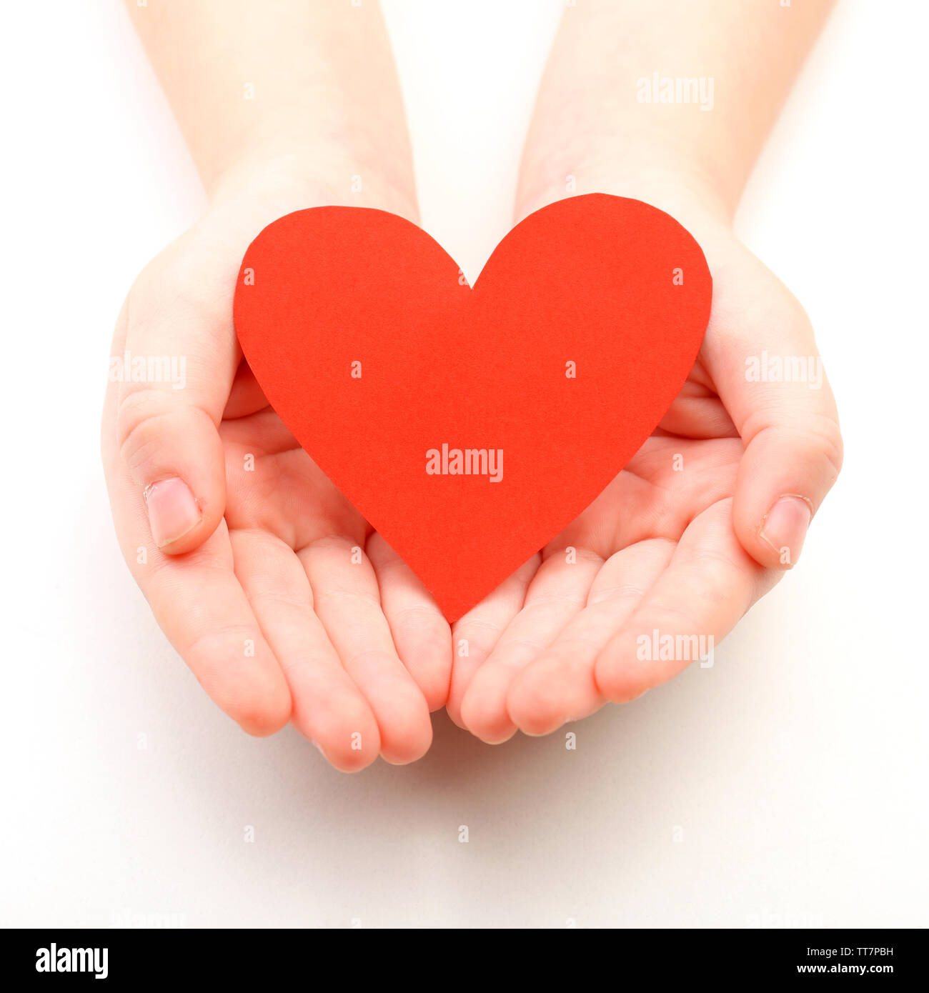 Heart in child hands isolated on white Stock Photo - Alamy