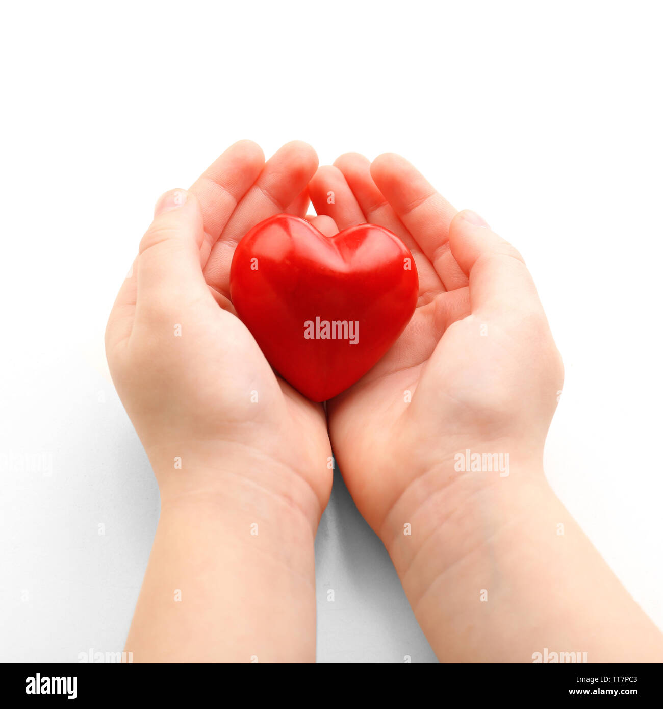 Heart in child hands isolated on white Stock Photo - Alamy