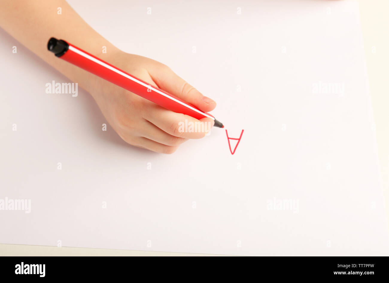 Child hand writing letters Stock Photo - Alamy