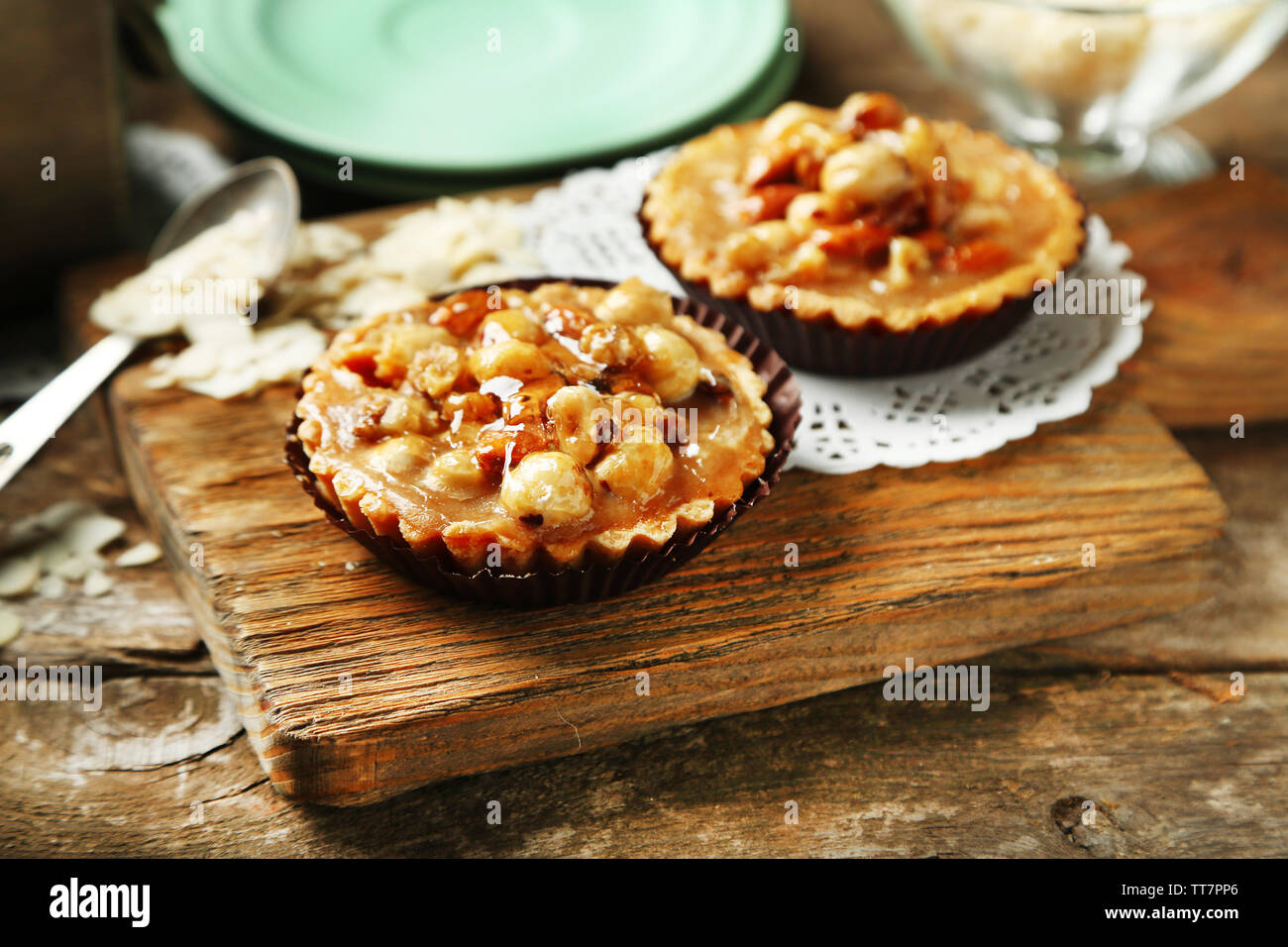 Mini cakes with nuts on wooden background Stock Photo - Alamy