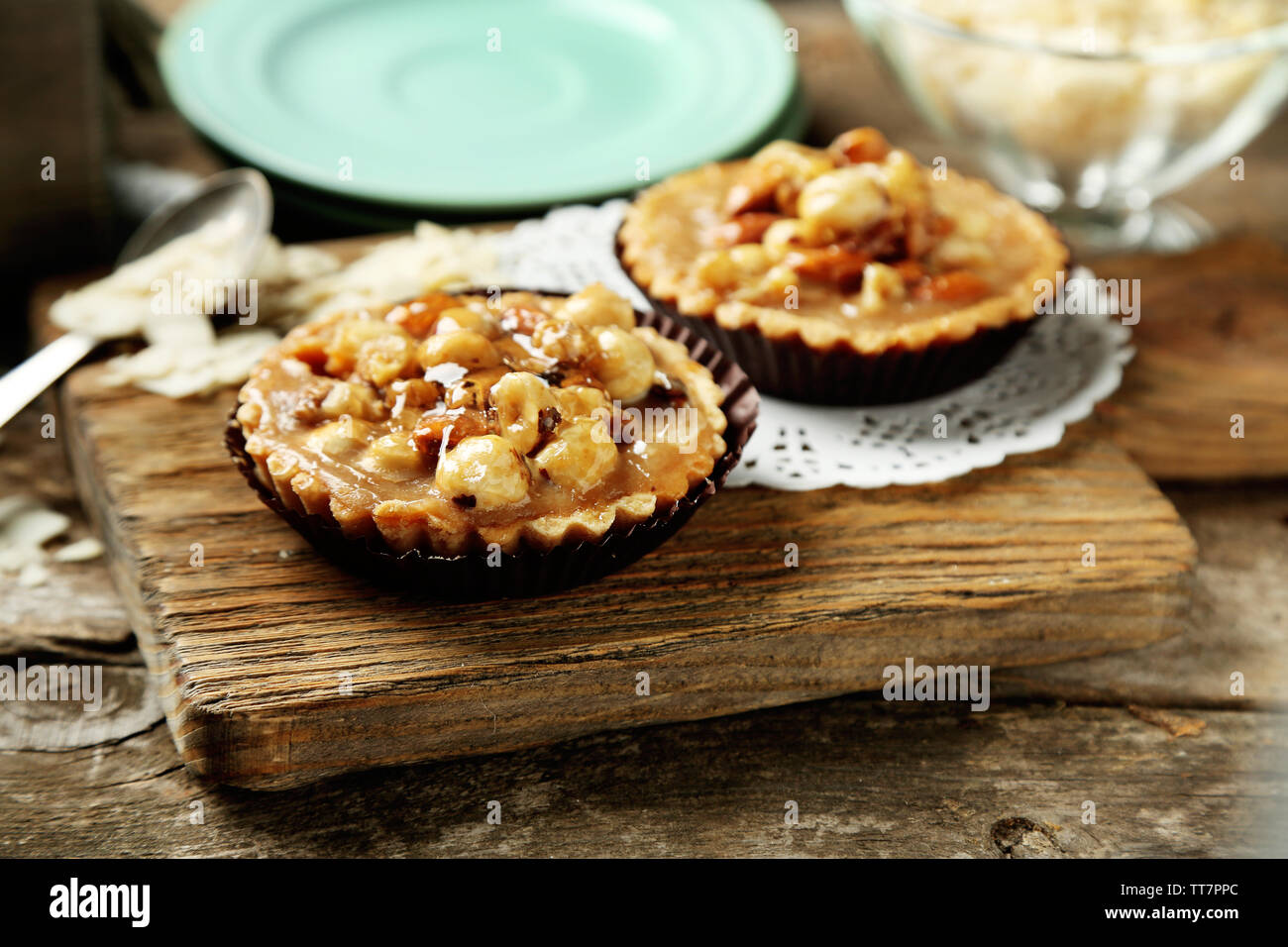 Mini cakes with nuts on wooden background Stock Photo - Alamy