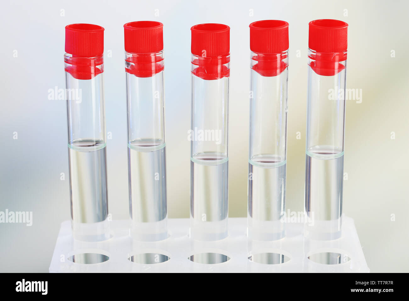 Test tubes on light background Stock Photo - Alamy
