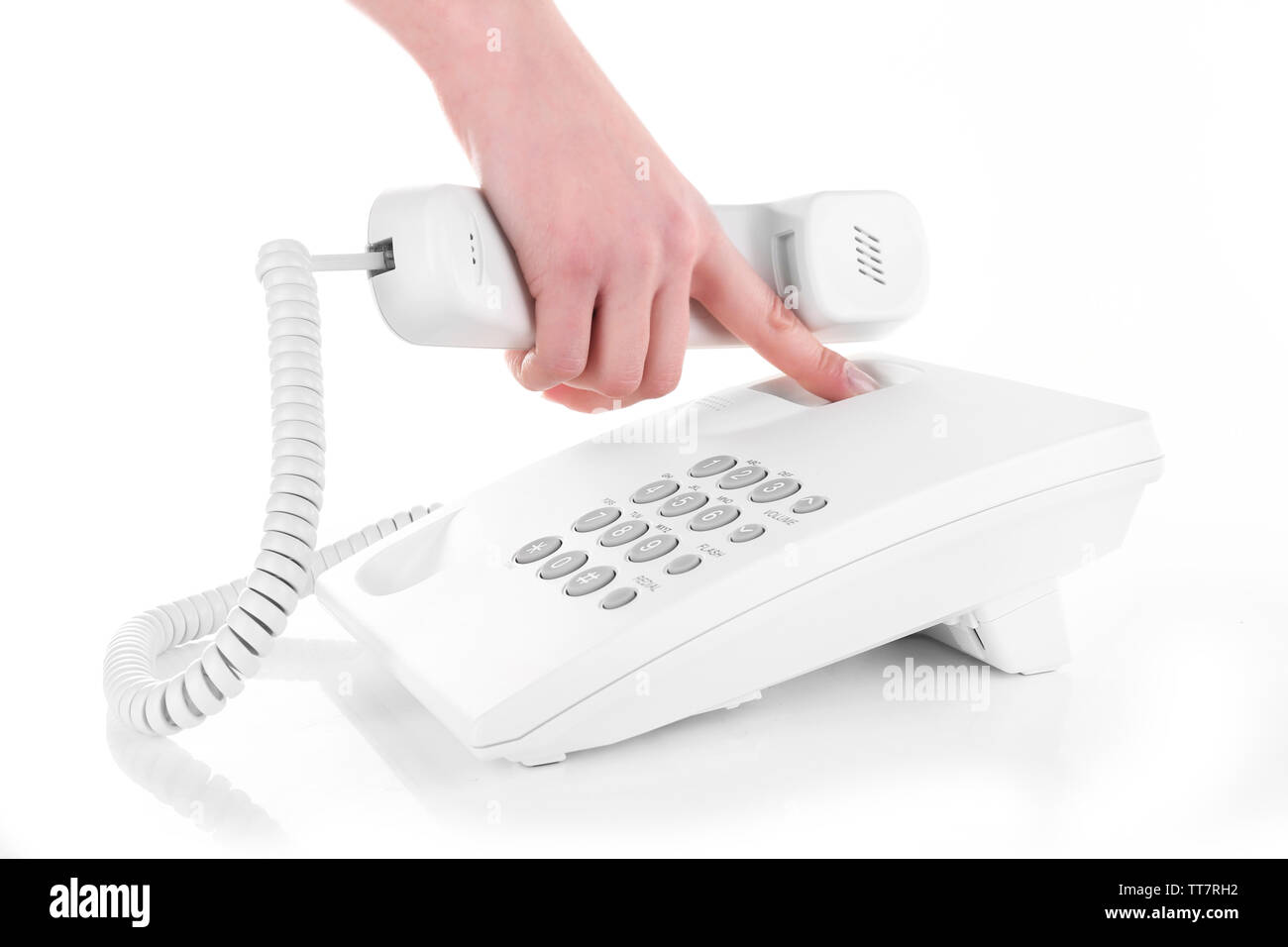 Female hand holding phone receiver isolated on white Stock Photo - Alamy