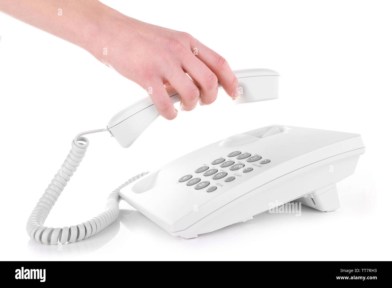 Female hand holding phone receiver isolated on white Stock Photo - Alamy