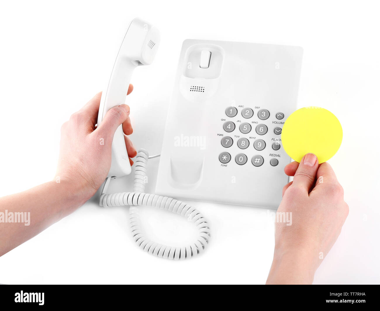 Female hand holding phone receiver isolated on white Stock Photo - Alamy