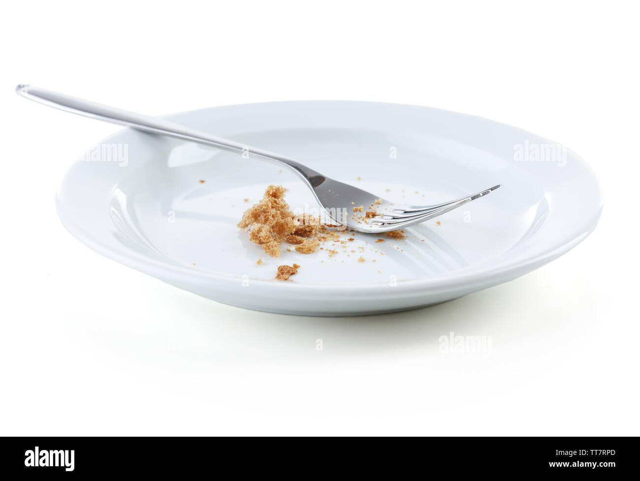 Bread crumbs on plate with fork isolated on white Stock Photo - Alamy