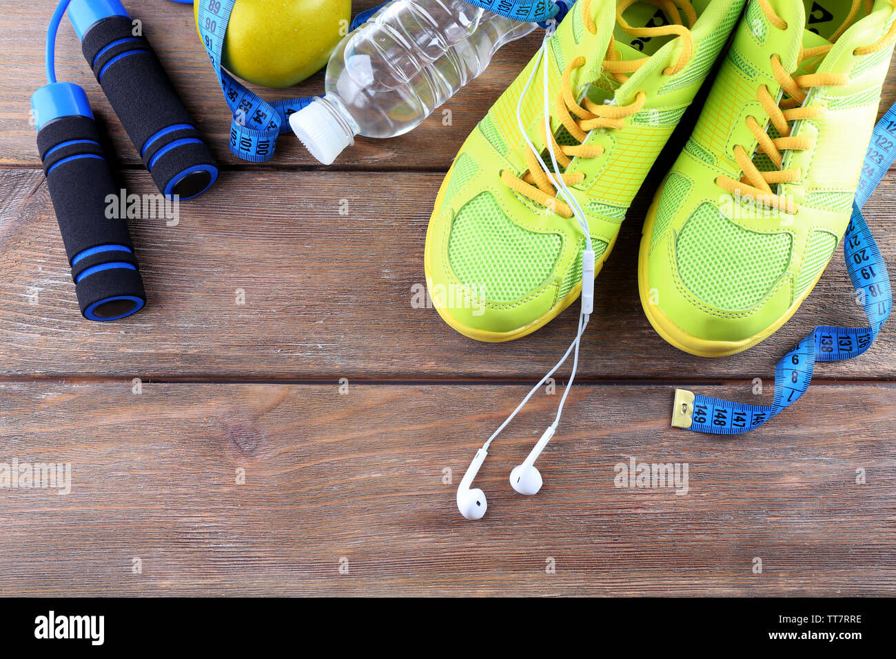 Different tools for sport on wooden background Stock Photo - Alamy
