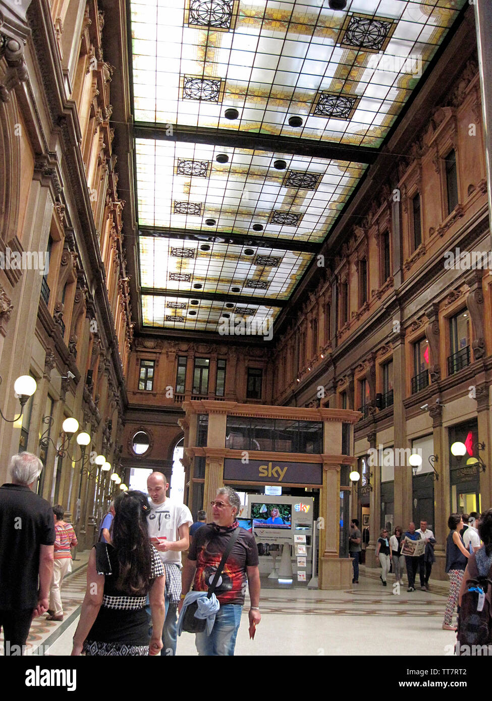 INTERIOR OF SHOPPING MALL WITH STAINED GLASS CEILING AND TOURISTS, ROME ...