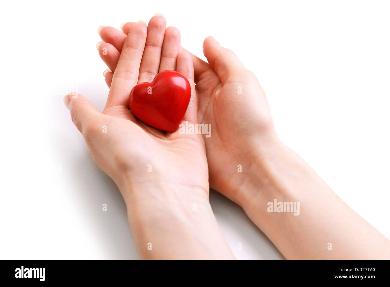 Heart in female hands isolated on white Stock Photo - Alamy