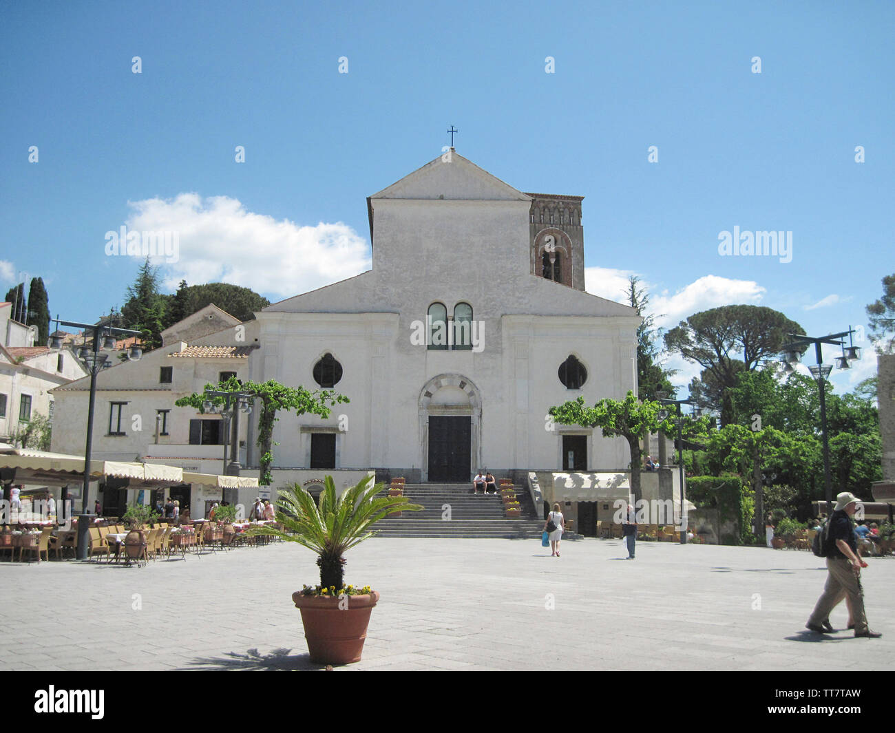 A VIEW OF THE VILLAGE SQUARE IN RAVELLO WITH A CHURCH AND OPEN AIR ...