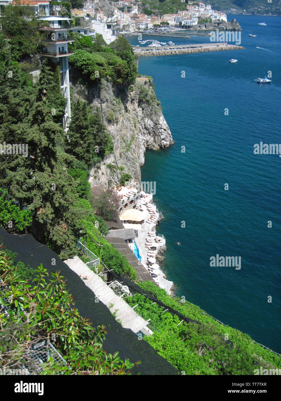 HOTEL RIGHT ON THE COAST OF AMALFI WITH TOURISTS SUN BATHING, AMALFI ...