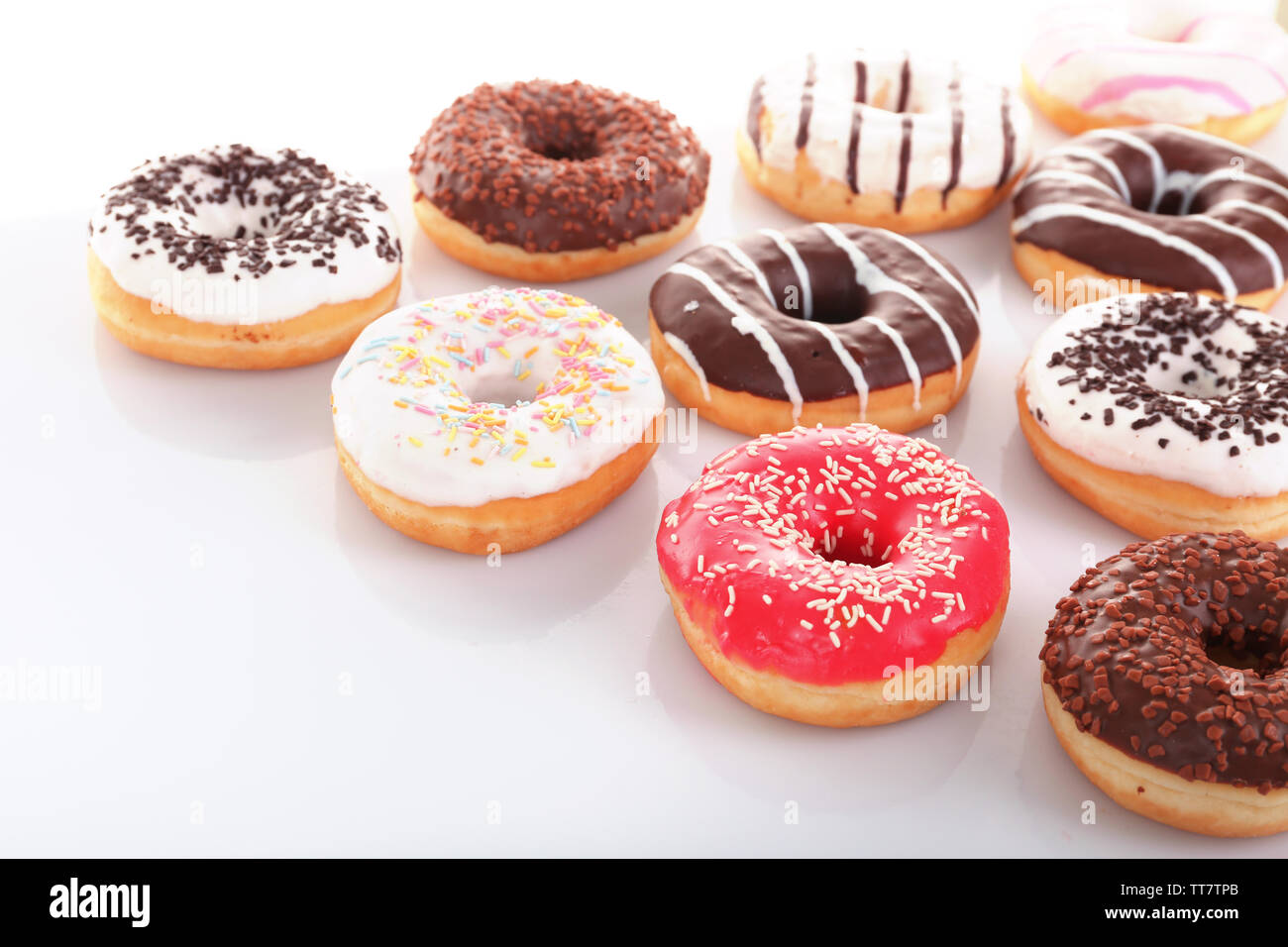 Delicious donuts with icing isolated on white Stock Photo - Alamy