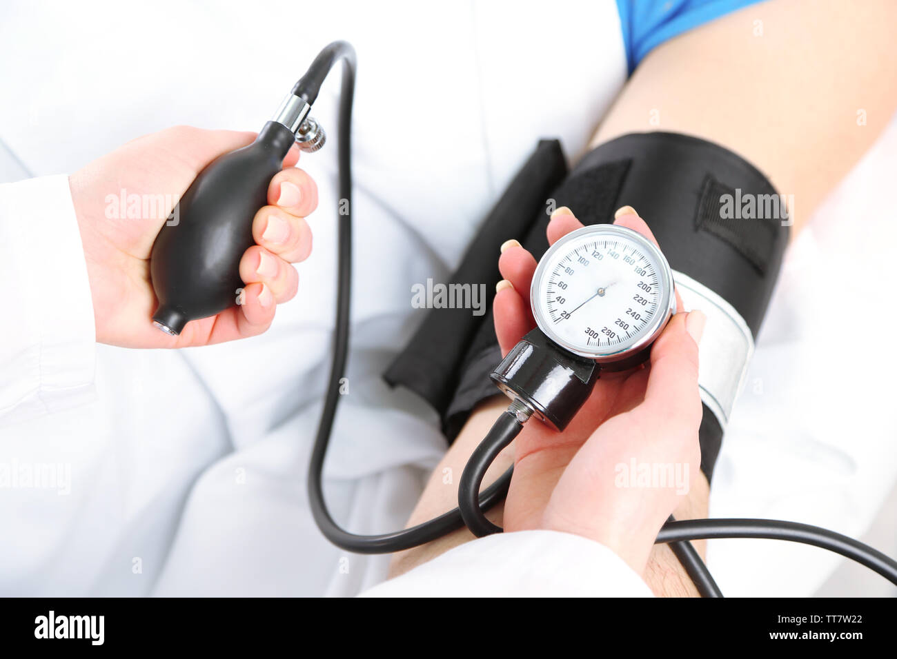 Doctor measuring patient pressure close up Stock Photo - Alamy