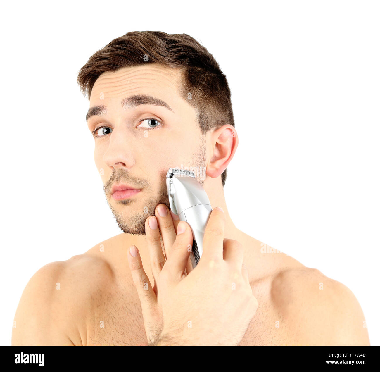 Handsome young man shaving his beard isolated on white Stock Photo - Alamy