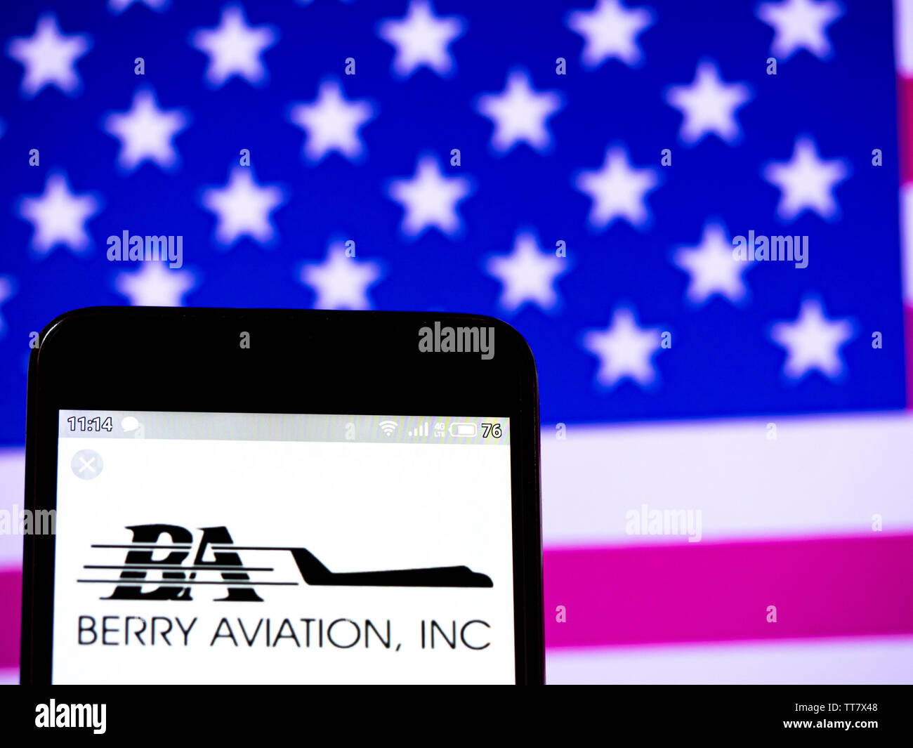 In this photo illustration the Berry Aviation logo is seen displayed on a smartphone Stock Photo ...
