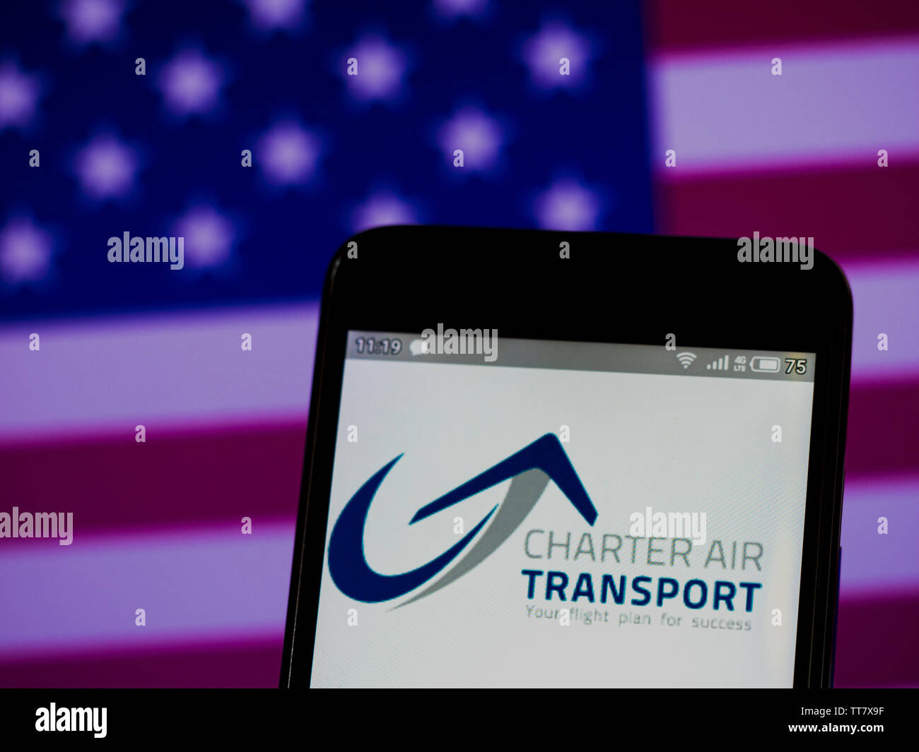 In this photo illustration the Charter Air Transport logo is seen ...