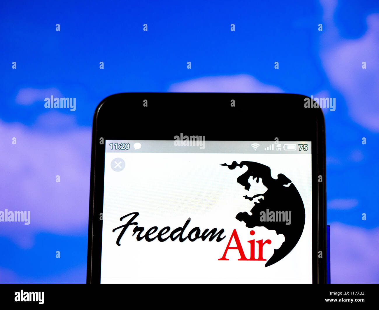 In this photo illustration the Freedom Air logo is seen displayed on a ...