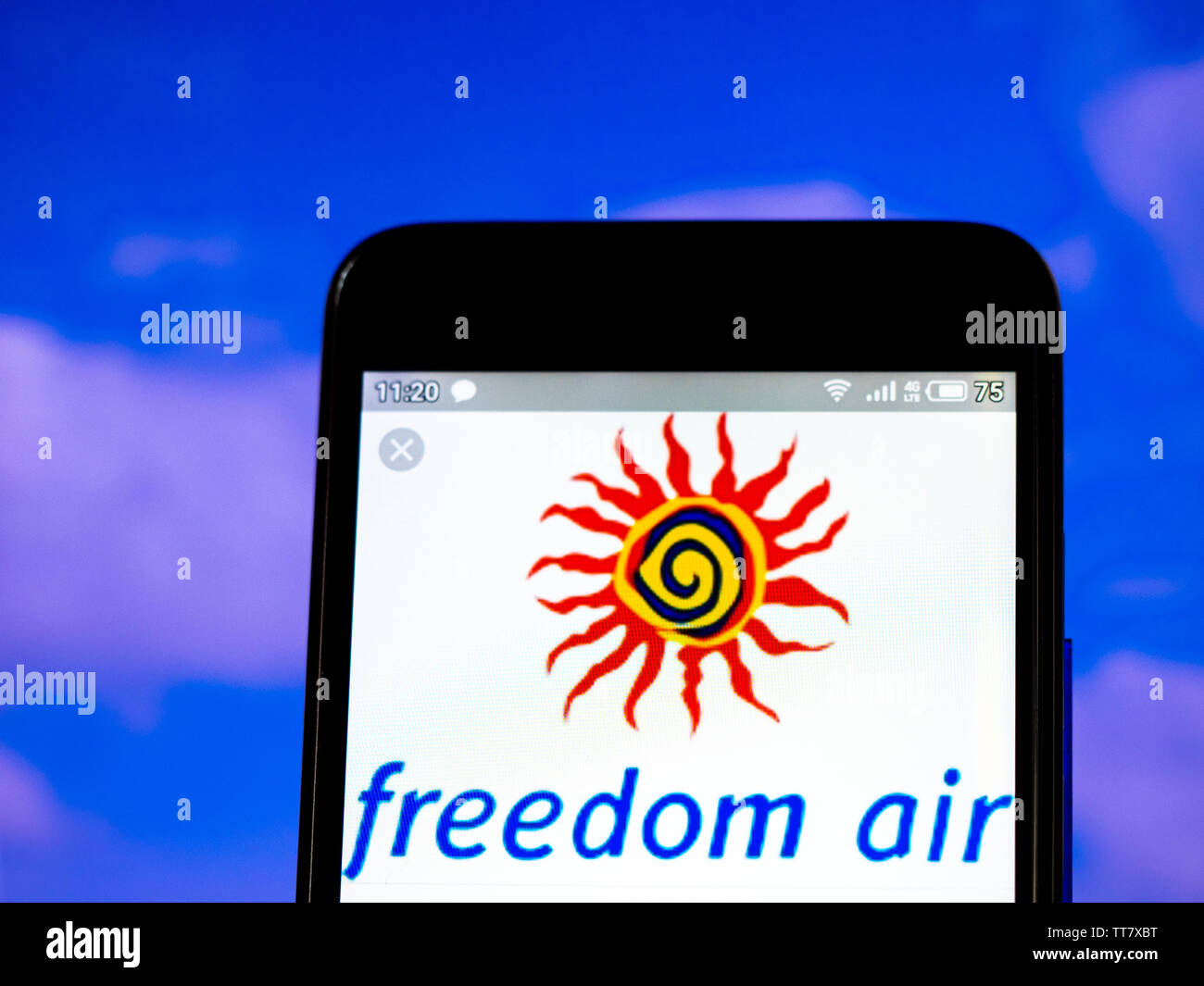 In this photo illustration the Freedom Air logo is seen displayed on a ...