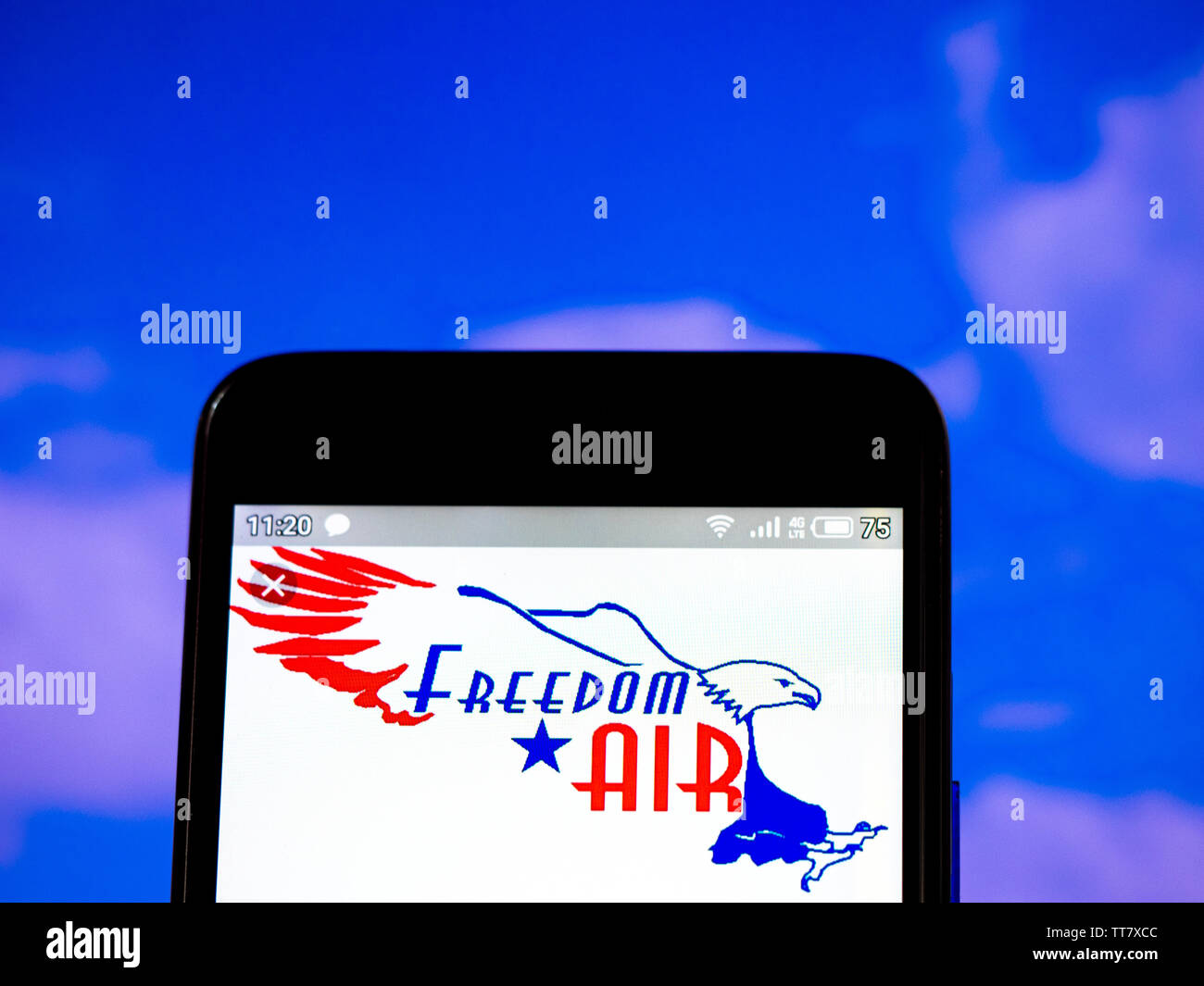 In this photo illustration the Freedom Air logo is seen displayed on a ...
