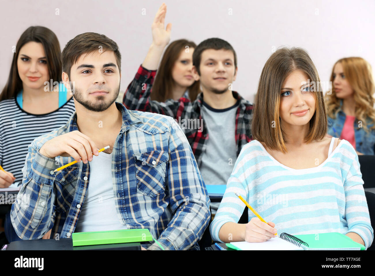 Group of students sitting in classroom Stock Photo - Alamy